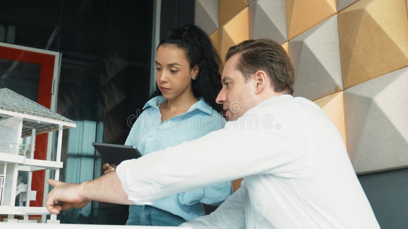 Project Manager Pointing and Discussion about Building Design ...