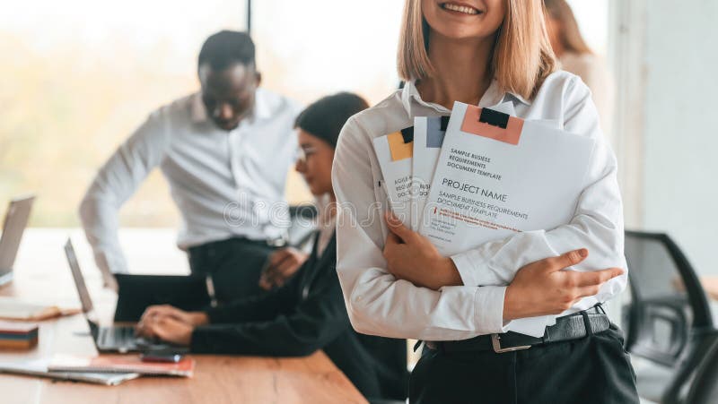 Project Manager is Standing with Documents. Group of Office Workers are ...