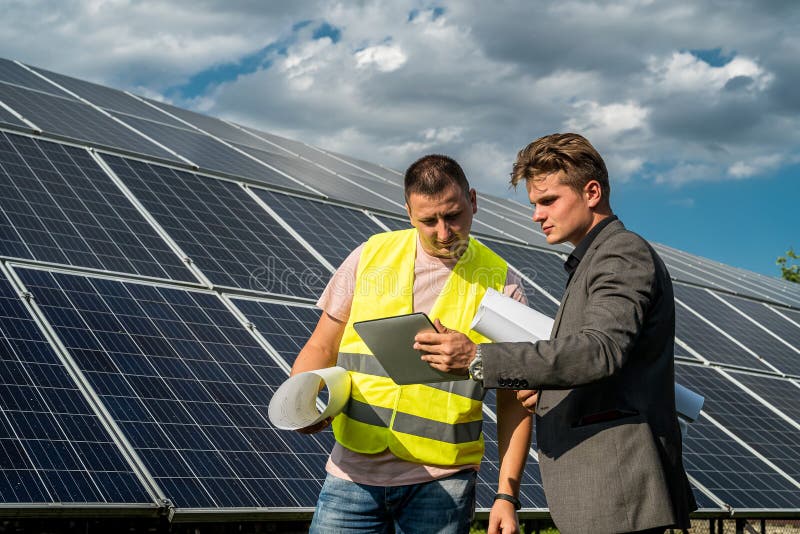 Project Manager and Worker Discussing New Solar Panels Installation ...