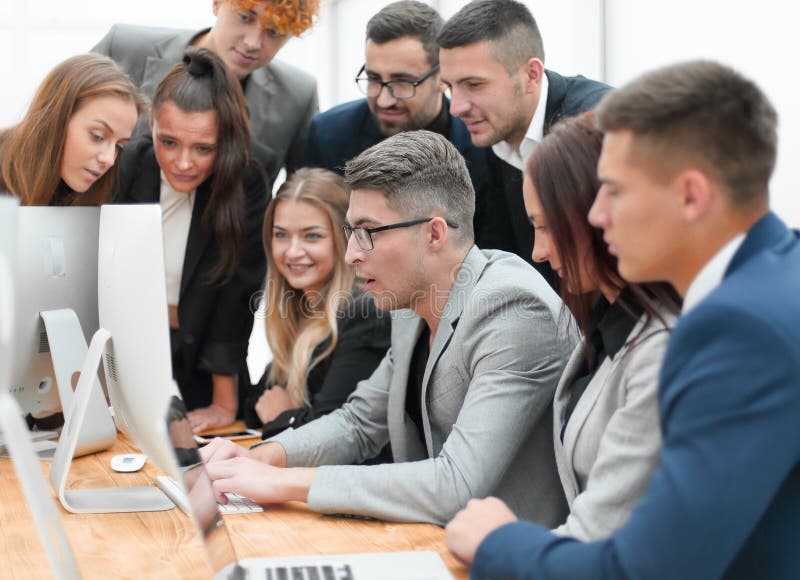 Project Manager and the Working Group Looking at the Computer Screen ...