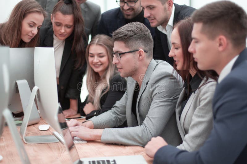Project Manager and the Working Group Looking at the Computer Screen ...