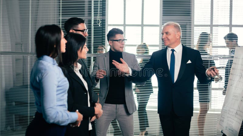 Project Manager and Working Group Standing in the Conference Room ...