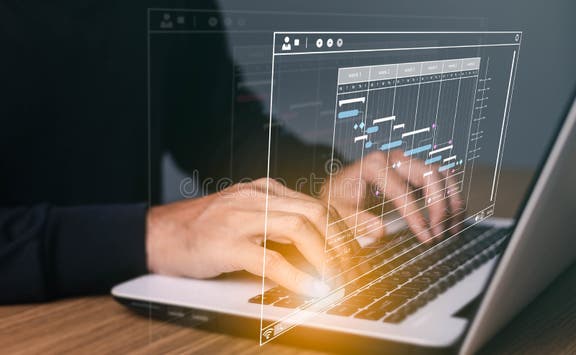 Project Manager Working on Laptop and Updating Tasks and Milestones ...