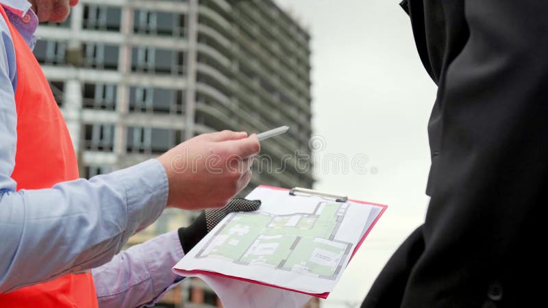 Project Team Conducting Inspection of Apartment Building Under ...