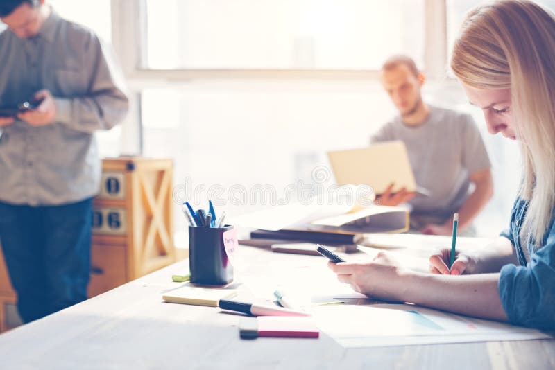 Project Team Working in Office. Laptop, Tablet Computer, Mobile Phone ...