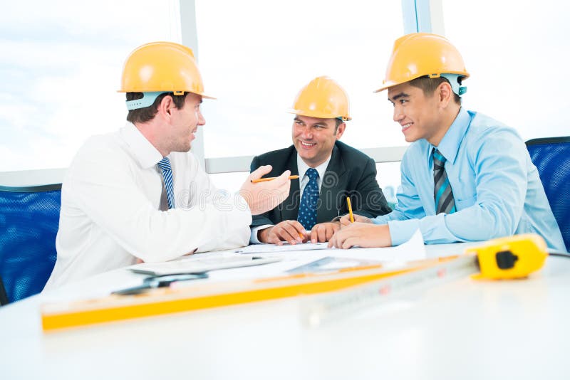 Engineers Talking at Office Stock Image - Image of blueprint ...