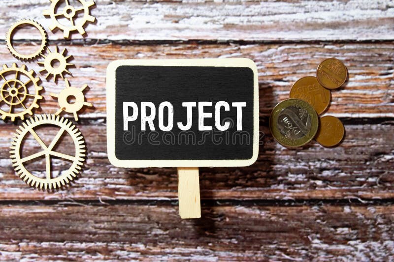 PROJECT is Written in a Document on the Office Desk with Office ...