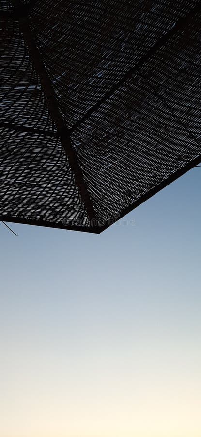 A Projection of a Straw Canopy Against a Blue Sky Stock Photo - Image ...