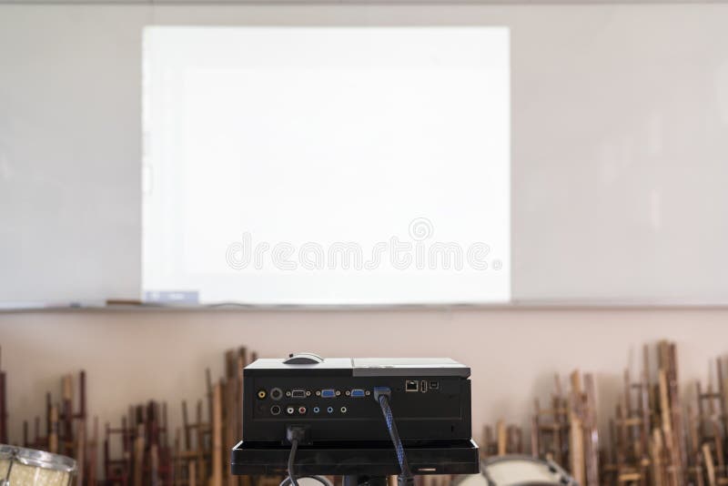 Projector in Action with Illuminated, Teacher Teaching Schoolchildren ...