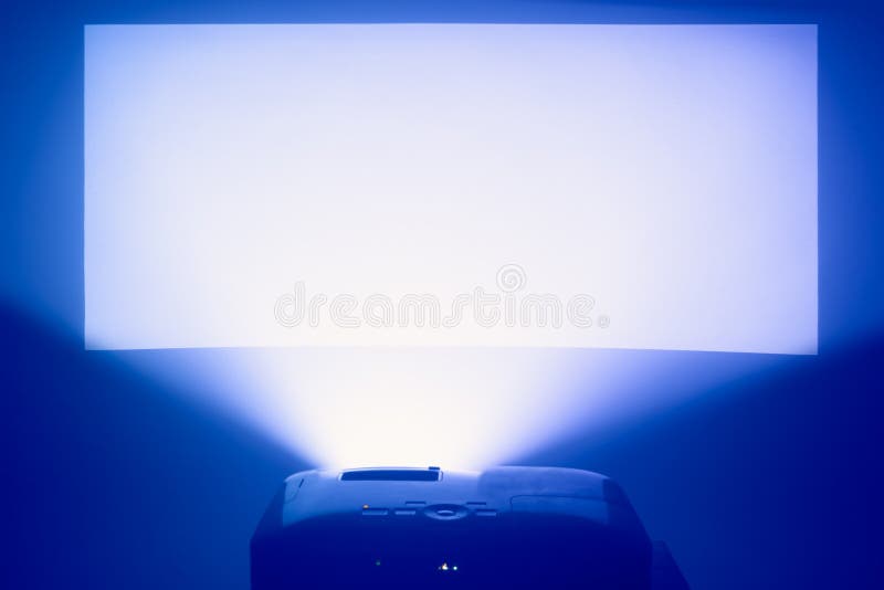 Projector in Action with Illuminated Warm Blue Screen Stock Photo ...