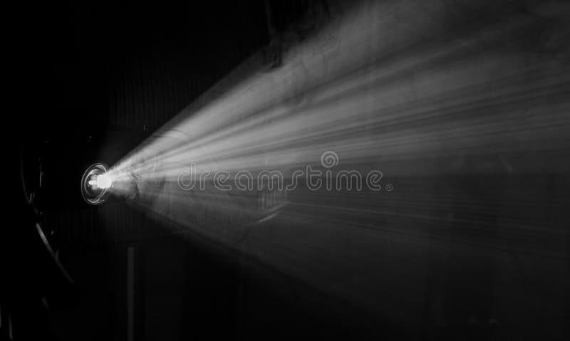 Projector Beam Casting Light in a Dark Room Stock Photo - Image of ...