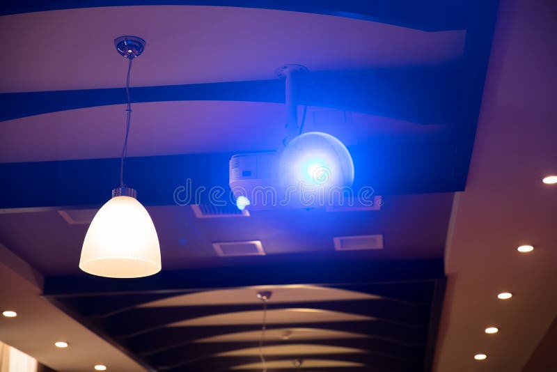 Projector in dark room stock photo. Image of smoke, projector - 205287622