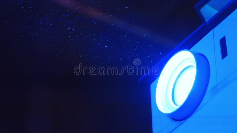 Projector in Operation. Dust in Cinema Hall is Visible in Ray of Blue ...