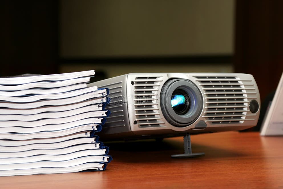 Projector with Pile of Books Stock Photo - Image of indoors, equipment ...