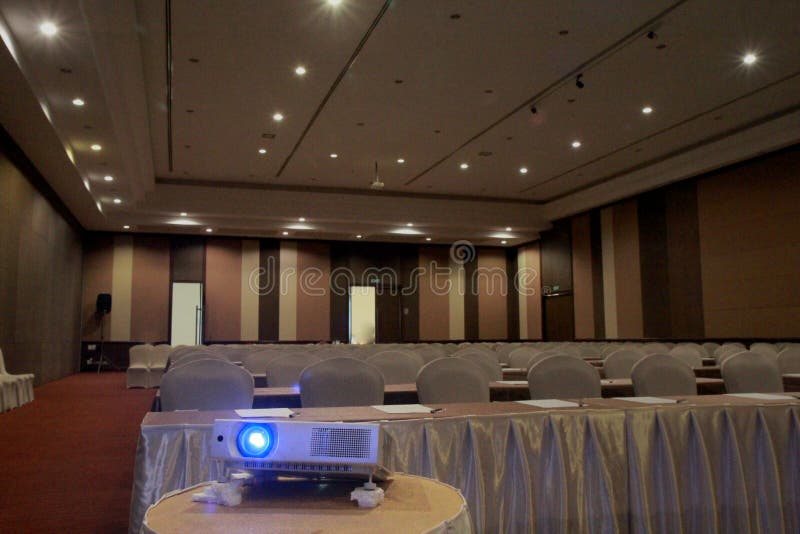 The Projector is Placed on a Table Covered with a White Cloth Pl Stock ...