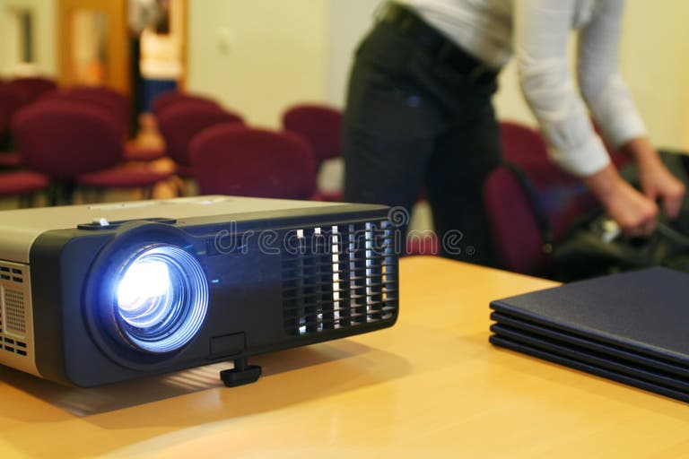 Projector on Table with Person Behind (horizontal) Stock Image - Image ...
