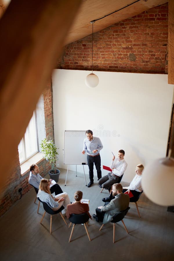 Aerial View of Young People Talking, Working, Discussing Problems and ...