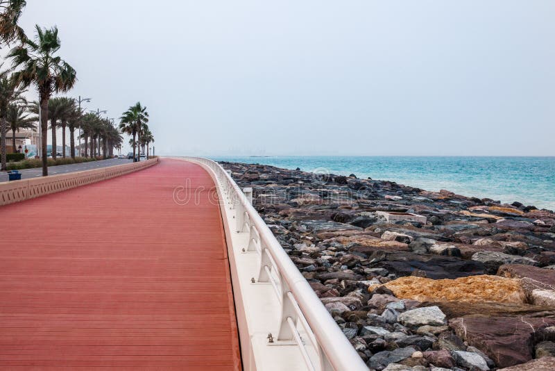 Promenade with Walkway and White Fence Stock Photo - Image of wave ...