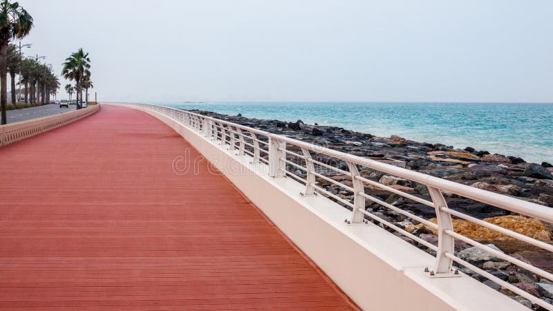 Promenade with Walkway and White Fence Stock Photo - Image of stones ...