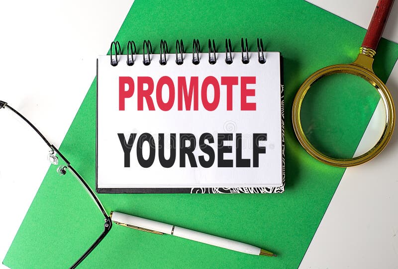 PROMOTE YOURSELF Text on Notebook on Green Paper Stock Image - Image of ...