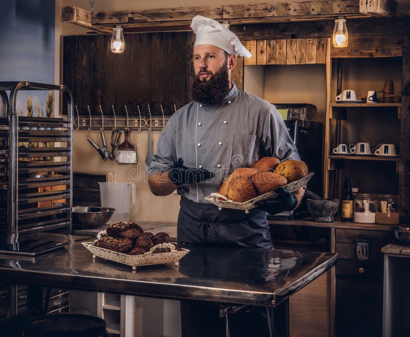 Handsome Bearded Chef in Uniform Showing Tray of Fresh Bread in the ...