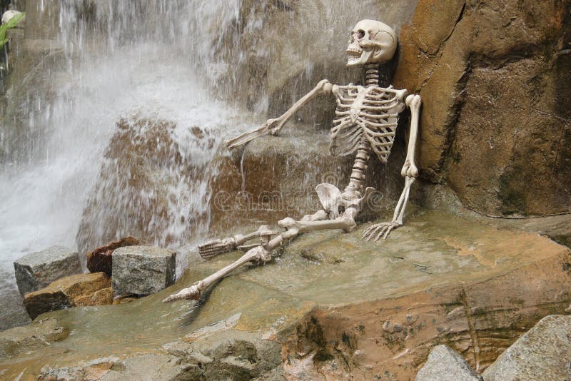 Skeleton Under the Waterfall Stock Photo - Image of night, prop: 99995240