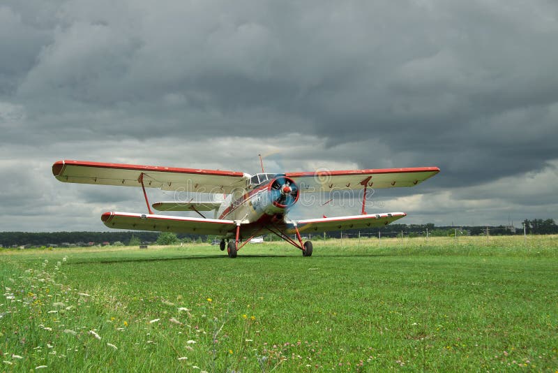 Old Biplane Takeoff Under the Storm Stock Image - Image of airstrip ...