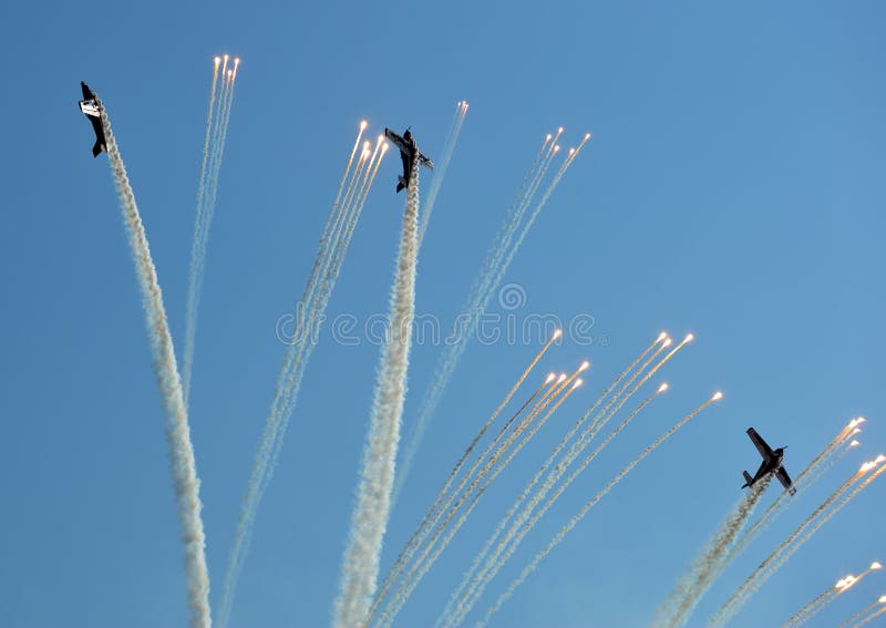 Propeller Planes Firing Flares during an Air Show Stock Photo - Image ...