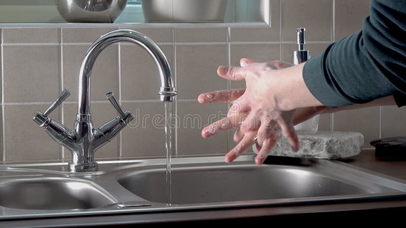 Proper Drying of Hands Demonstrated at Steel Kitchen Sink Stock Footage ...
