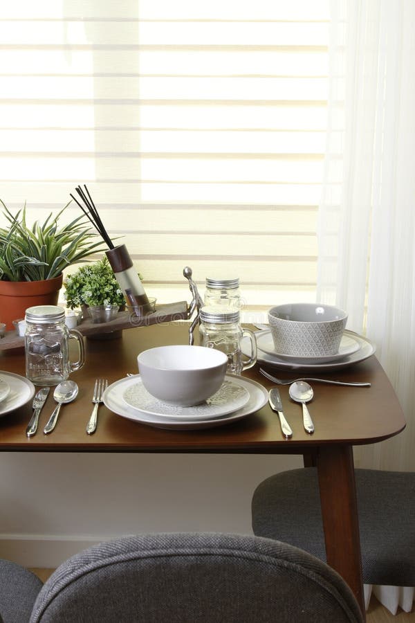 Proper Table Setting on a Small Wood Table Stock Image - Image of ...