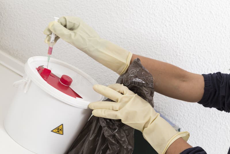 Leaving a Used Syringe in the Bucket Marked for Biological Risk Stock ...