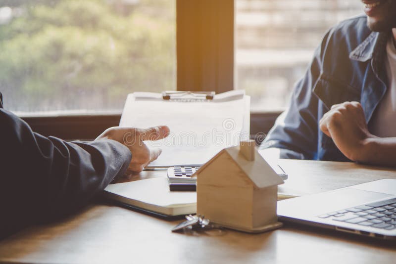 Property Agent Explaining Contract Condition To Client Stock Photo ...