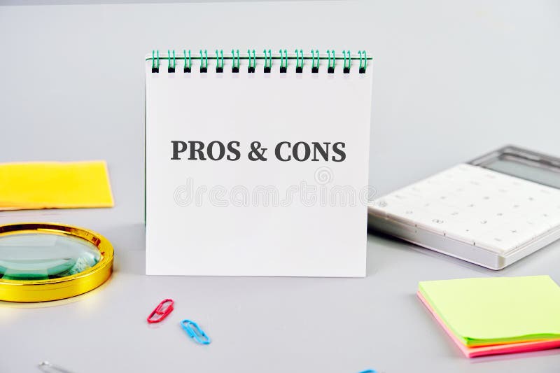 PROS and CONS Message on a White Notebook on a Gray Background in a ...