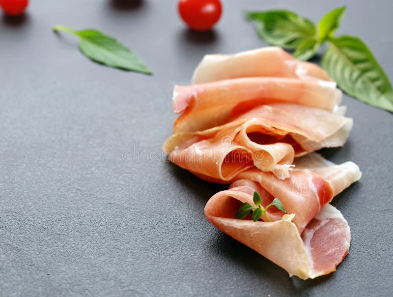 Prosciutto ham on a board stock image. Image of italian - 335094685