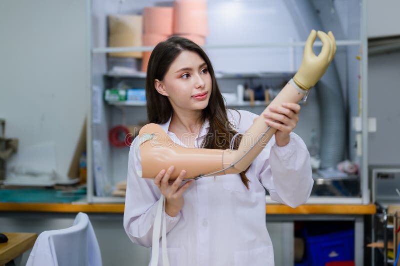 Prosthetic Technician Holding Prosthetic Arm Checking and Controlling ...