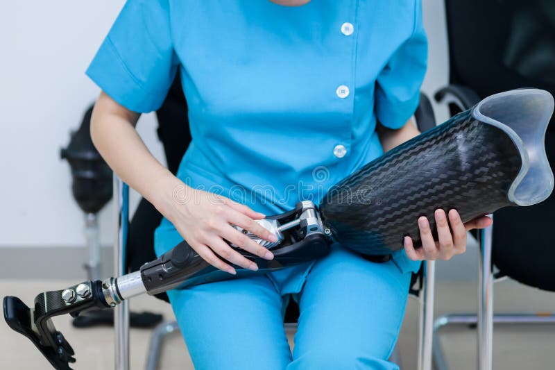 Prosthetic Technician Holding Prosthetic Leg Checking and Controlling ...