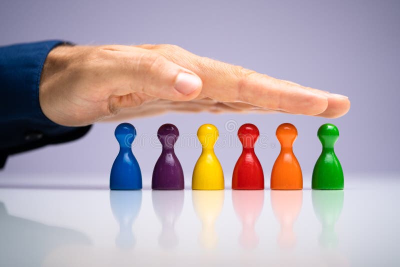 Protect Inclusion and Equality. Protect Colored Pawns Stock Photo ...