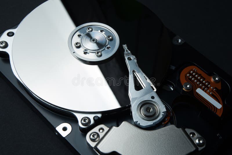 A Magnetic Disk for Storing Data on the Hard Disk on a Black Background ...