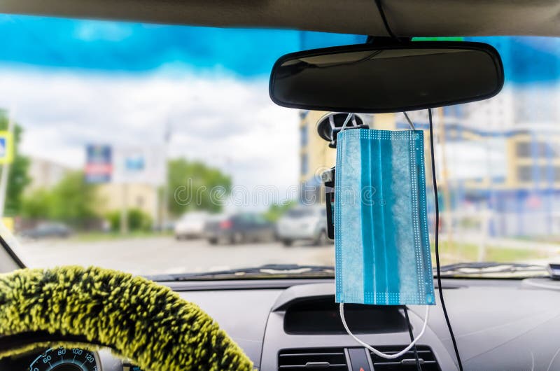 Protective Blue Mask Hangs in the Interior of the Car Stock Photo ...