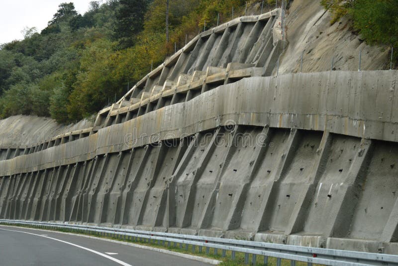 Protective concrete wall stock photo. Image of grass - 160888332