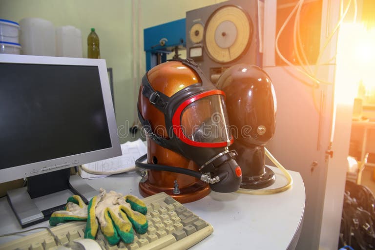 Protective Diving Helmets and Gloves Displayed in a Laboratory Setting ...