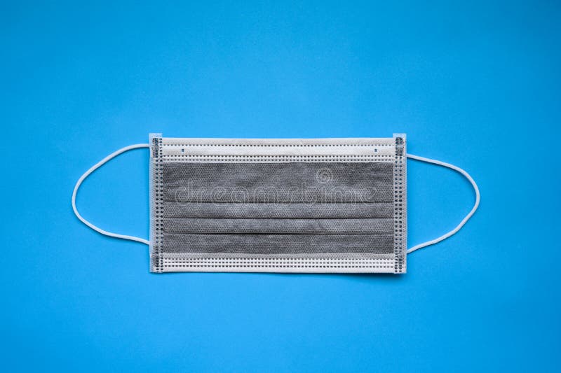 Protective Face Mask on Blue Background Stock Photo - Image of breath ...