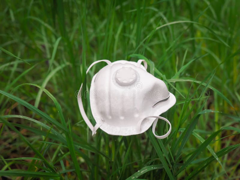 Protective Face Mask on the Grass in the Forest. during the Coronavirus ...