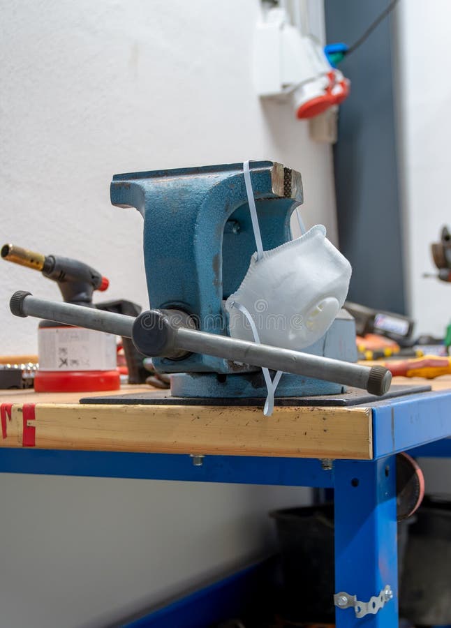 Table with Bench Vise and Protective Face Mask Placed on Stock Image ...