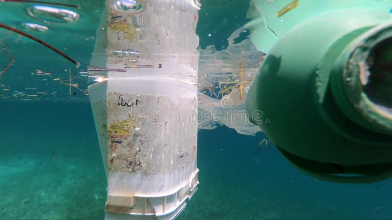 Protective Face Masks from Coronavirus Floating Under Water. Pollution ...