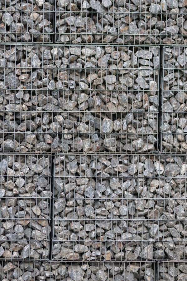 Protective Gabions with Grey Broken Stones Behind Grid As Solid Fence ...