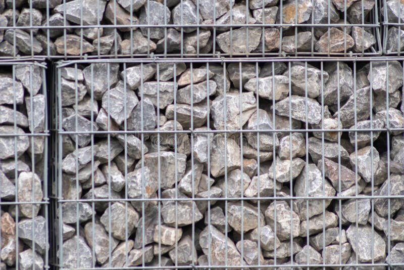 Protective Gabions with Grey Broken Stones Behind Grid As Solid Fence ...