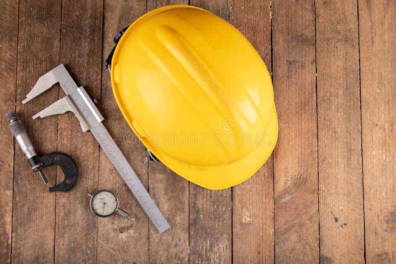 Protective Helmet and Measuring Tools. Work Accessories for Production ...