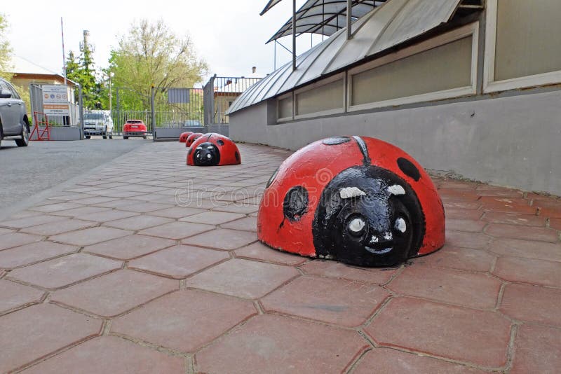 Hemispheres in the Form of Ladybugs Stand on the Street Stock Image ...