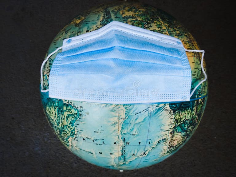 Protective Mask Wrapped Around the World Stock Photo - Image of concept ...